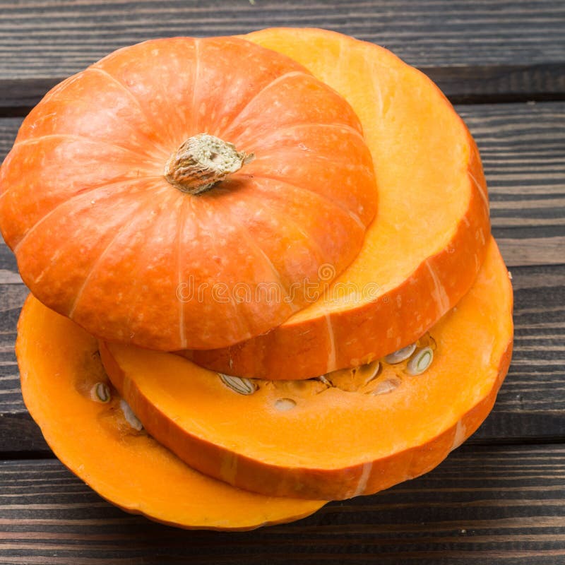 Raw Pumpkin Slices on the Dark Table Stock Photo - Image of dish ...