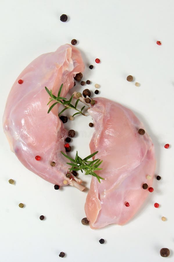 Raw Rabbit Legs with Bone with Peppercorns on a White Background Stock ...