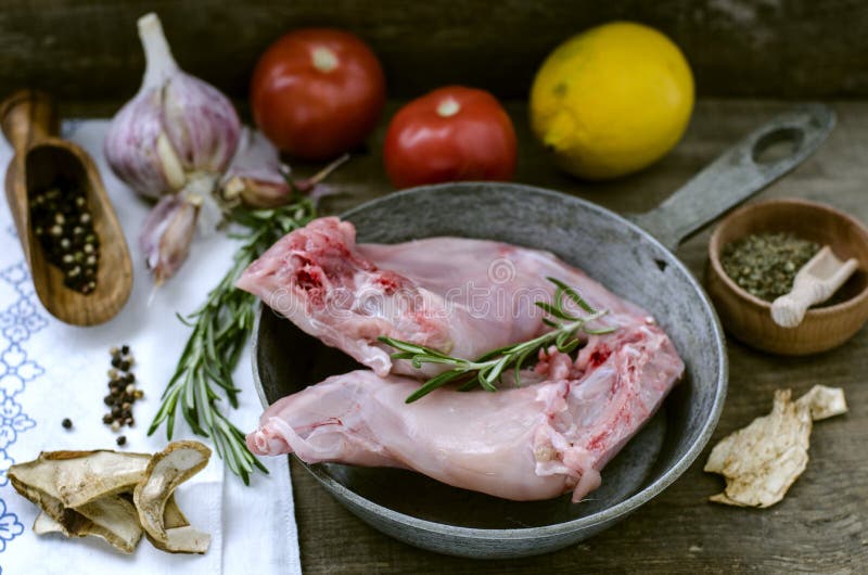 Raw rabbit legs and spices stock photo. Image of healthy - 55527580