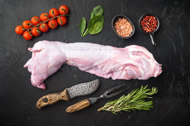 Raw Rabbit Meat with Spice and Ingredients, on Black Stone Background ...