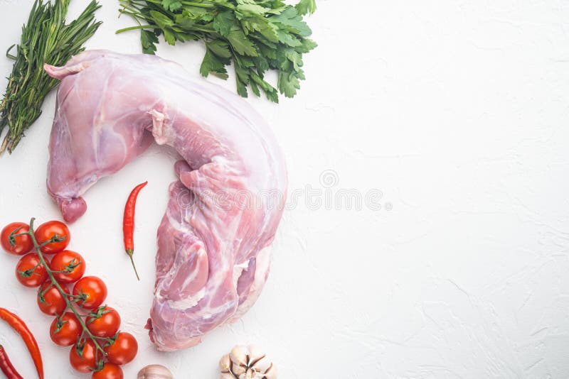 Raw Rabbit Meat with Spice and Ingredients, on White Stone Background ...