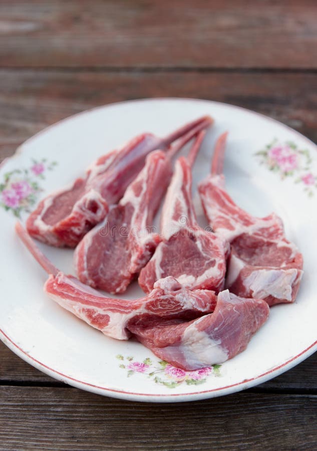 Raw Rack of Lamb on Vintage Plate Stock Photo - Image of healthy, lamb ...