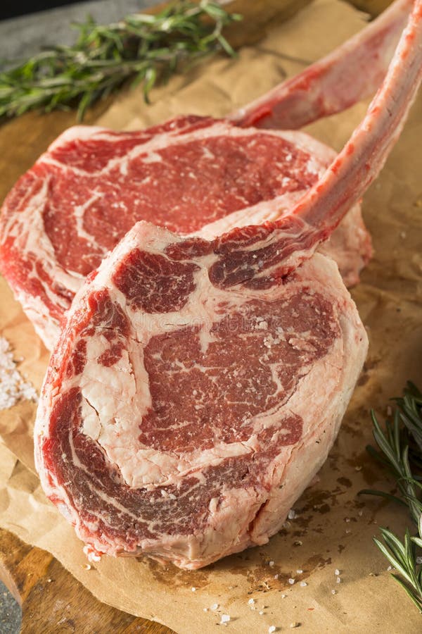 Raw Red Grass Fed Tomahawk Steaks Stock Image - Image of american ...