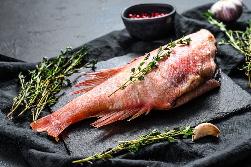 Raw Red Sea Perch on a Stone Board with Thyme. Black Background. Top ...