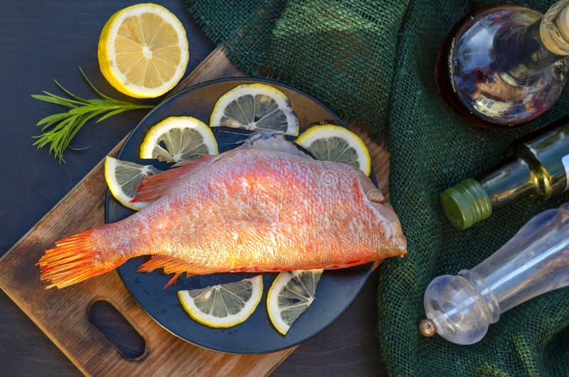 Raw Red Snapper on a Plate with Lemon Stock Image - Image of rosemary ...