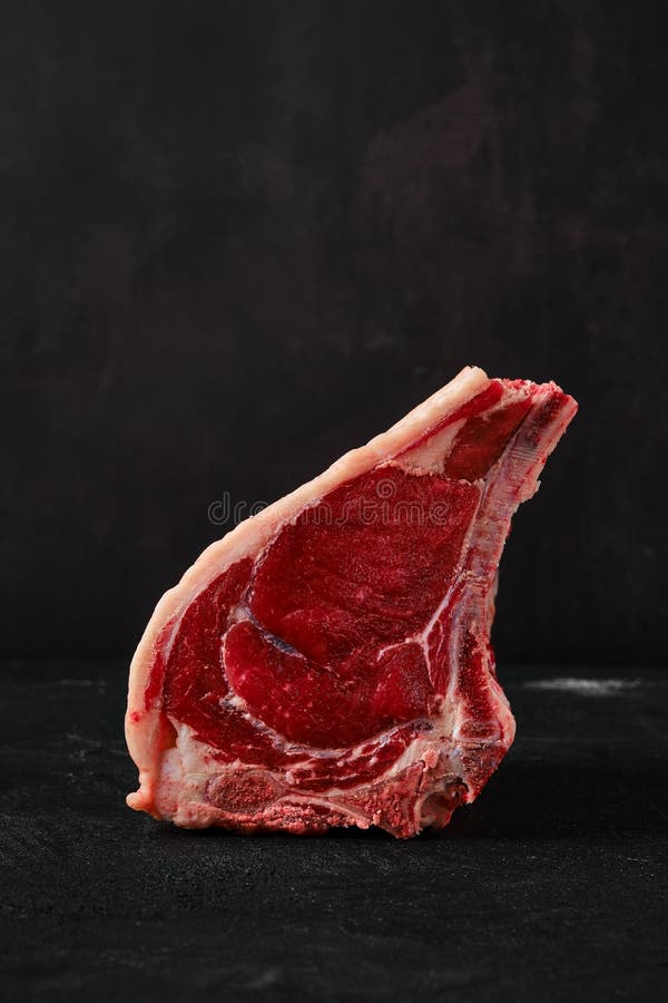 Raw Rib-eye Steak Bone in Closeup Stock Image - Image of gourmet, chop ...