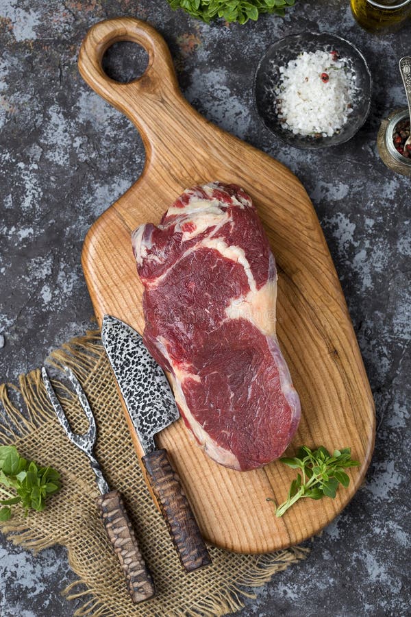 Raw ribeye steak stock photo. Image of buffalo, board - 114636100