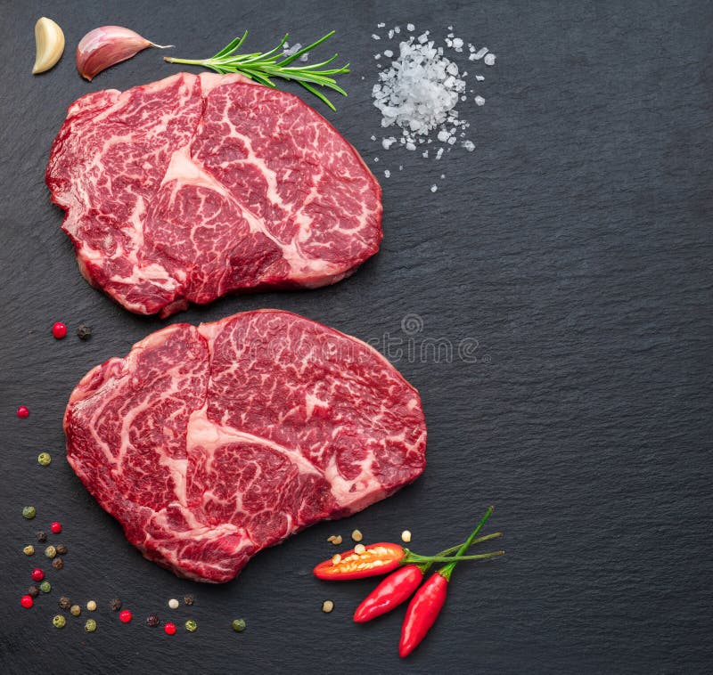 Raw Ribeye Steak on Stone Black Serving Plate. Flat Lay Stock Image ...