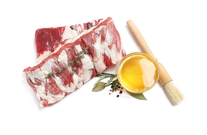 Raw Ribs with Herbs and Oil on White Background, Top View Stock Photo ...