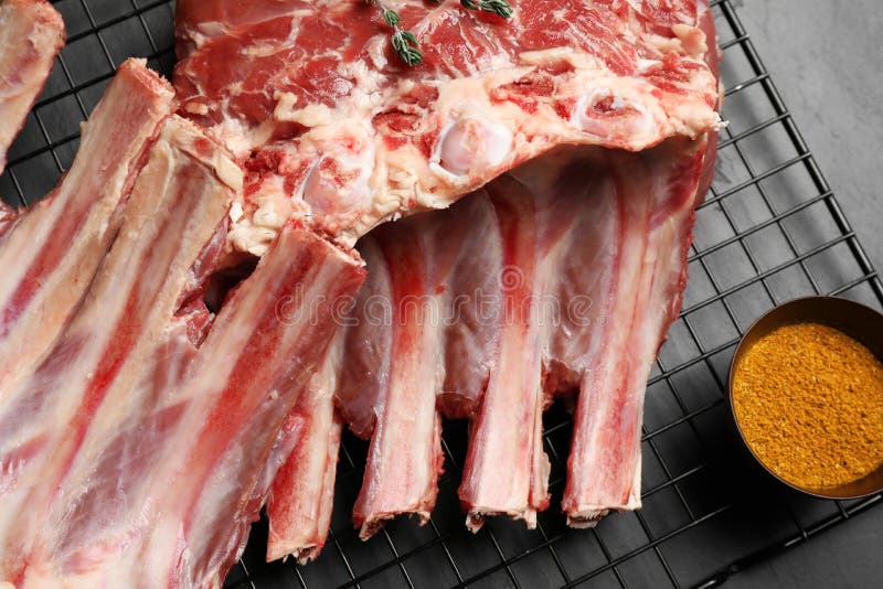 Raw Ribs and Spice on Cooling Rack, Closeup Stock Photo - Image of ...