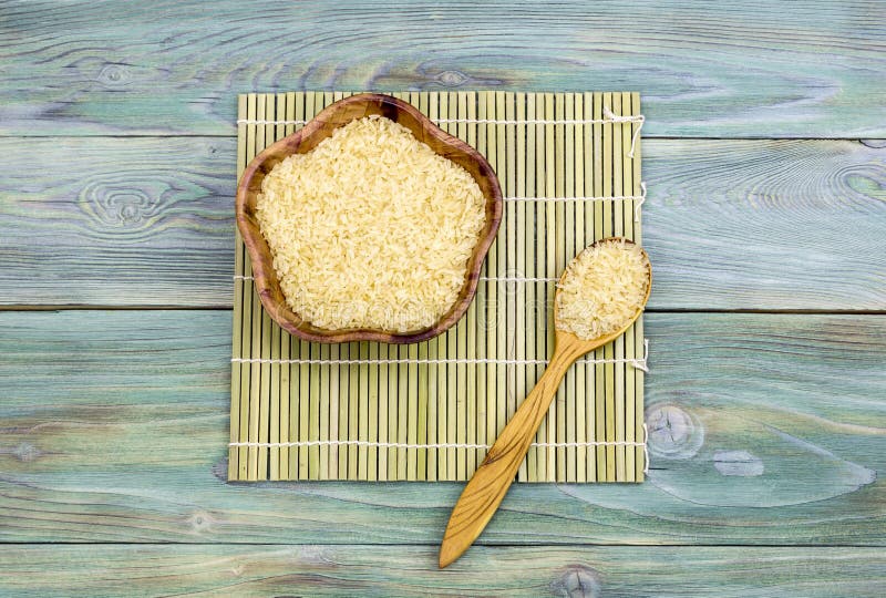 Raw rice in a bowl stock image. Image of grain, organic - 95332955
