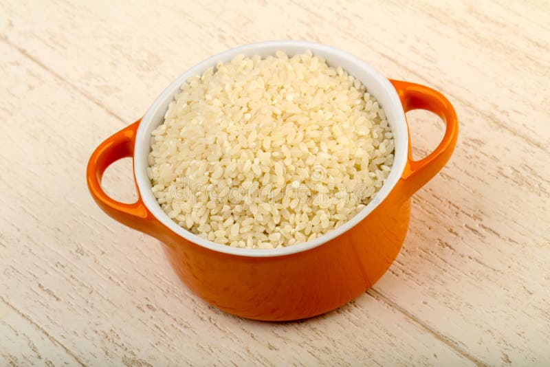 Raw rice heap stock photo. Image of chinese, bowl, uncooked - 118298812