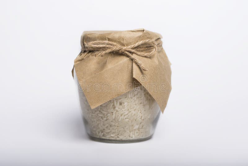 Raw rice in a jar on whit stock photo. Image of canning - 63444296