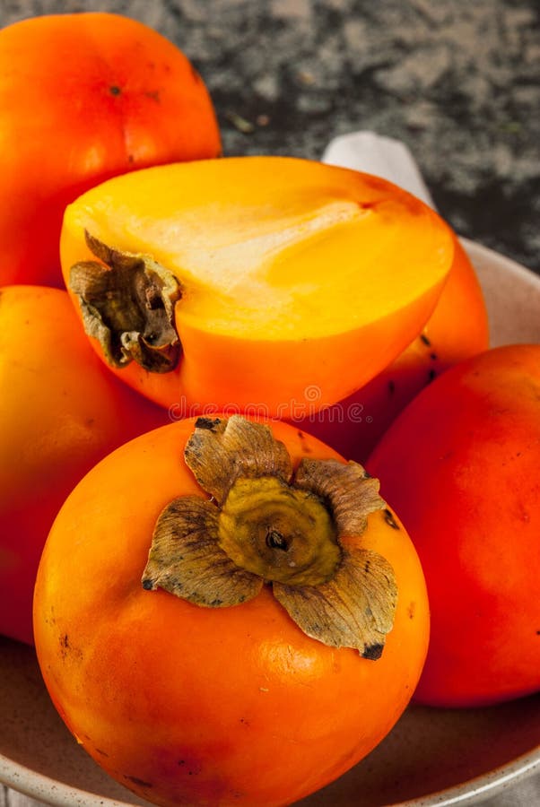 Raw ripe persimmon stock image. Image of delicious, exotic - 144834473