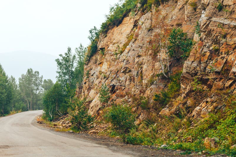 Raw Road with Rock Mountain and Green Trees Stock Photo - Image of dawn ...