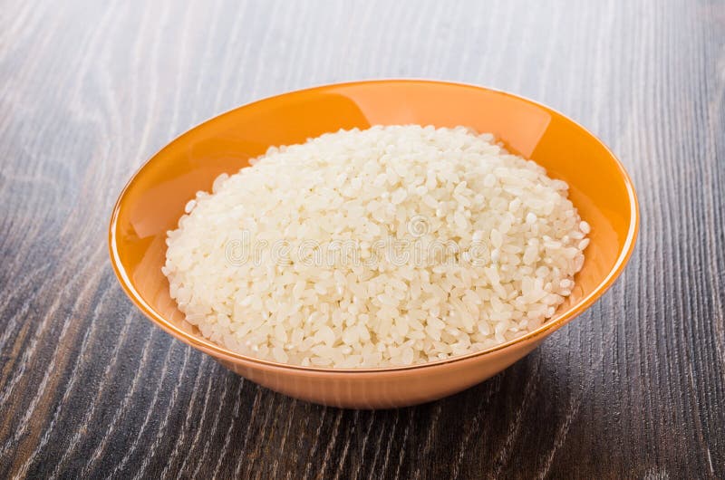 Raw Round Grain Rice in Bowl on Table Stock Photo - Image of bowl ...
