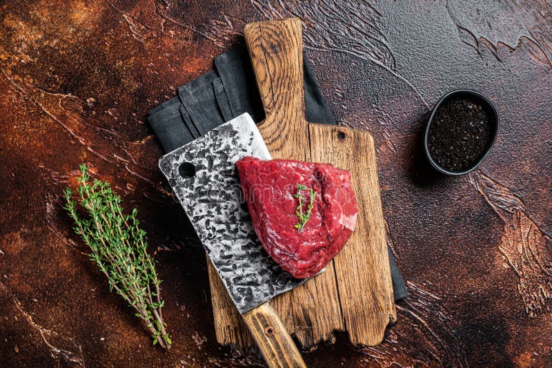 Raw Rump Steak on a Butcher Cutting Board. Dark Background Stock Photo ...