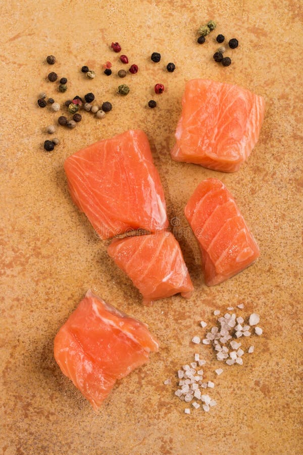 Raw Salmon Chunks with Coarse Salt and Black Peppercorn Stock Image ...