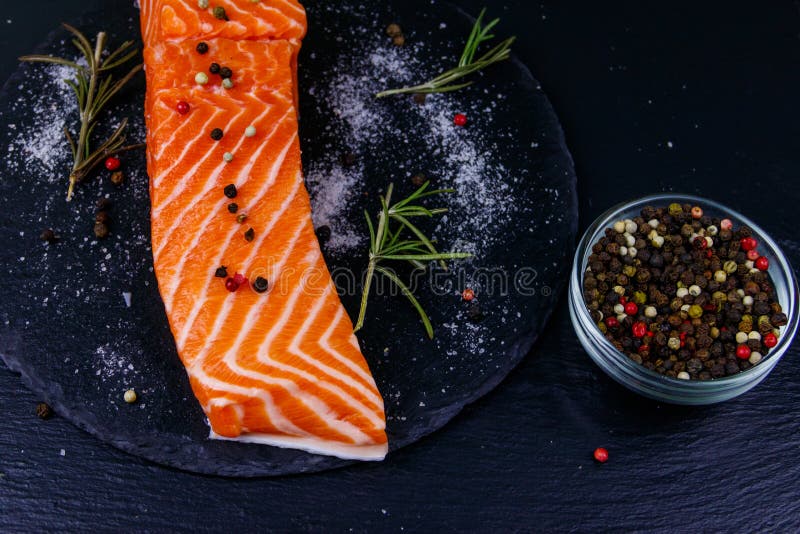 Raw Salmon Fillet with Spices on Black Slate Stock Photo - Image of ...