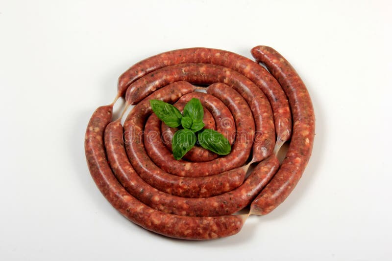 Raw Sausage with Basil Leaf Isolated on White Background. Stock Photo ...