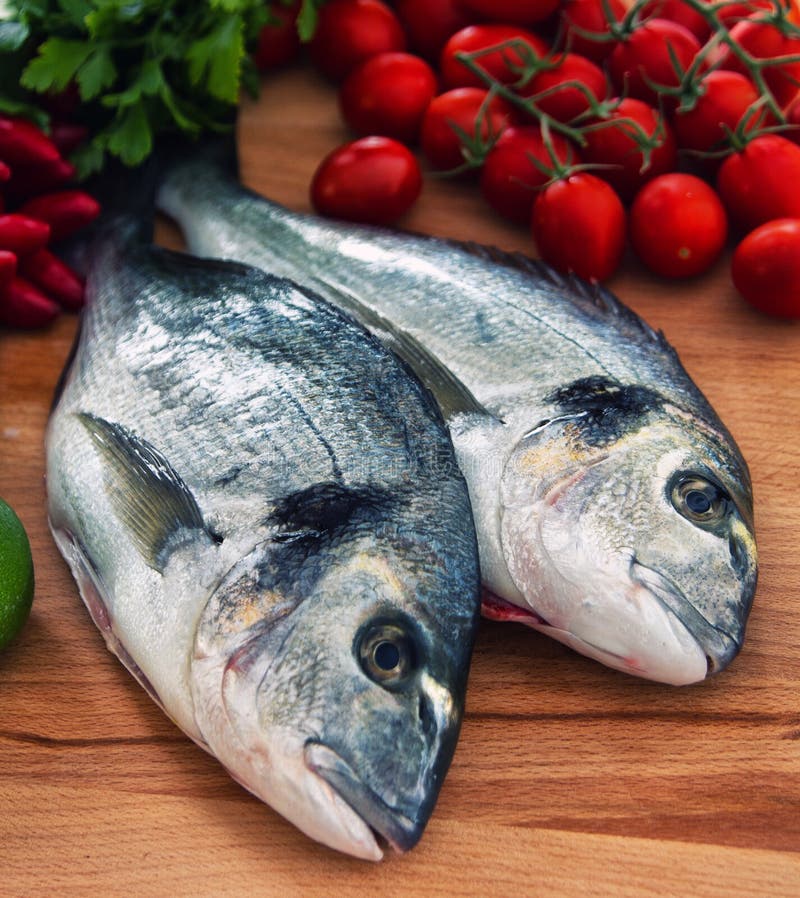 Raw Sea Bream Preparation with Herbs and Lemon Stock Image - Image of ...