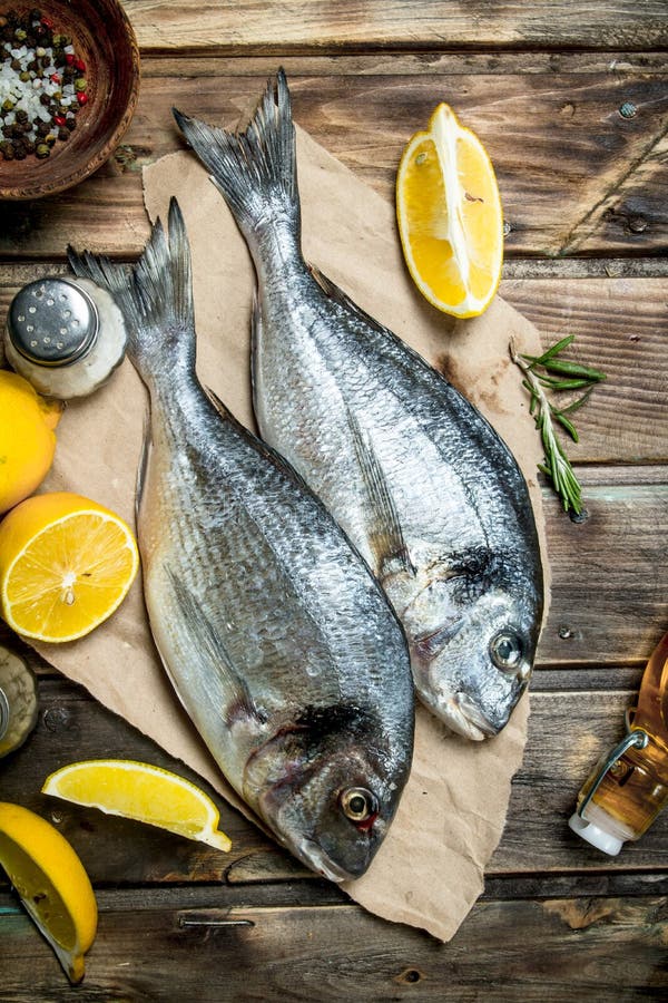 Raw Sea Fish Dorado with Lemon, Herbs and Aromatic Spices Stock Image ... Raw Sea Fish Dorado with Lemon, Herbs and Aromatic Spices Stock Image ...