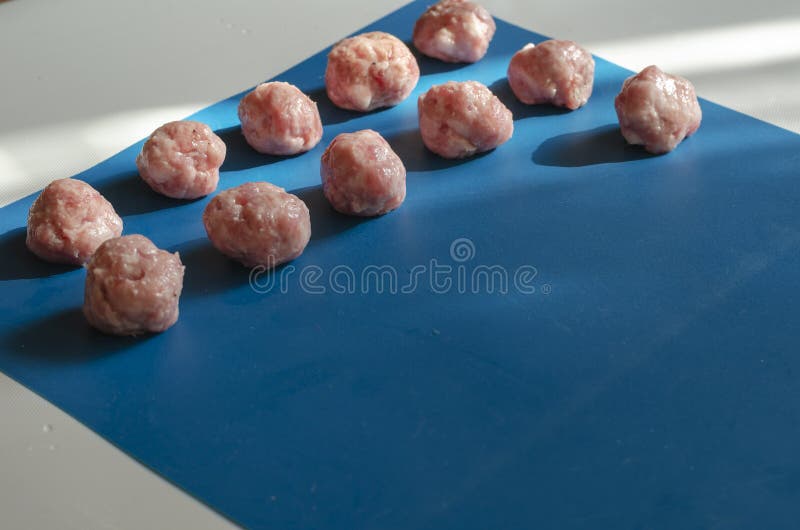 Raw Shaped Meatballs on Blue Stock Photo - Image of spices, shape ...