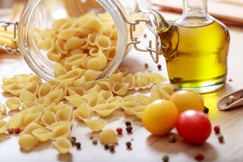 Raw Shells Pasta, Tomatoes and Olive Oil Stock Photo - Image of olive ...