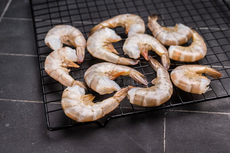 Raw Shrimps, Headless Fresh Prawns on a Rack. Top View Stock Photo ...