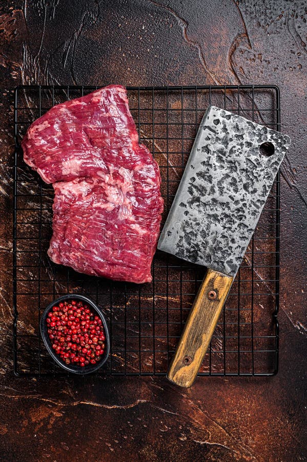 Raw Skirt Beef Steak on Meat Cleaver. Black Background Stock Image ... Raw Skirt Beef Steak on Meat Cleaver. Black Background Stock Image ...