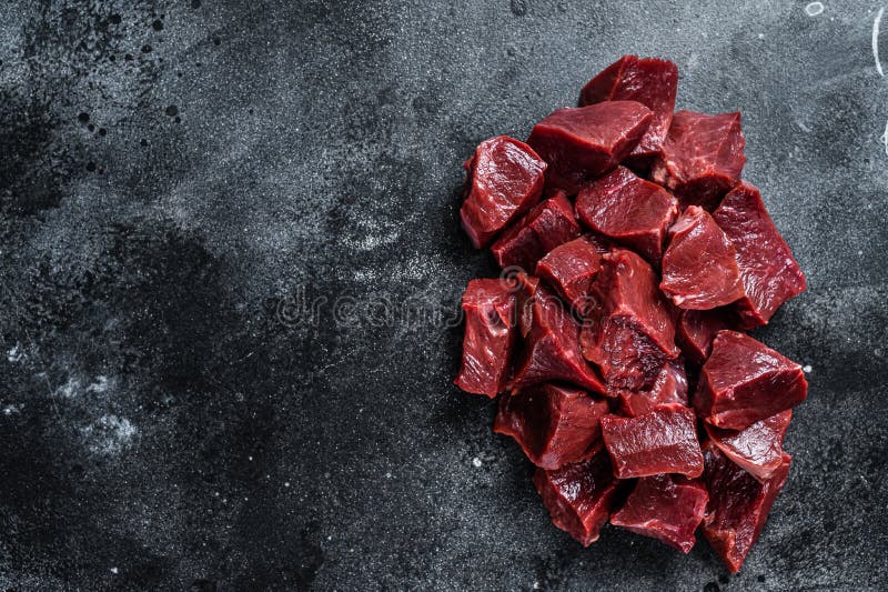 Raw Sliced Beef or Veal Heart. Black Background. Top View Stock Photo ...