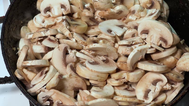 Raw Sliced Button Mushrooms on Frying Pan at Beginning Frying Stock ...