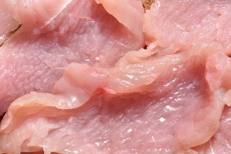 Raw and Sliced Turkey Meat. Fresh Pink Turkey Meat, Close-up Stock ...