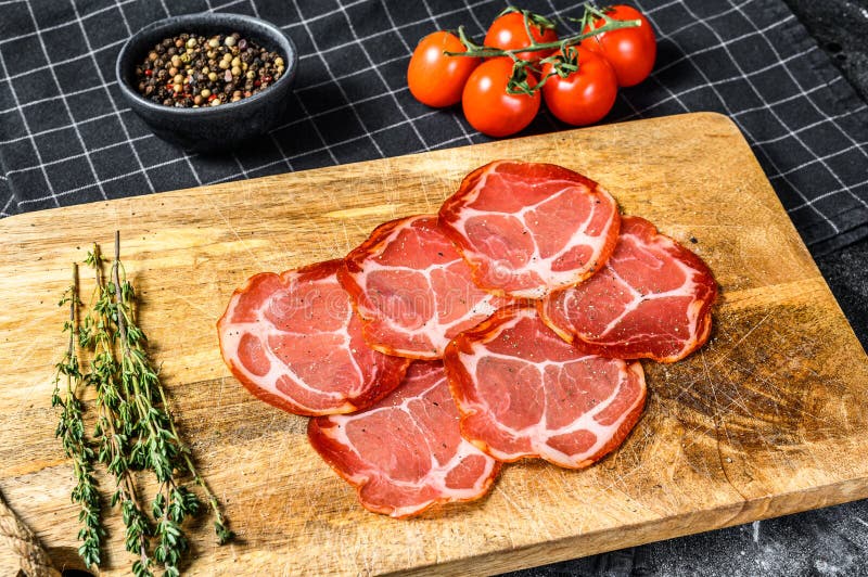 Raw Smoked Meat Jamon Lomo. Black Background Stock Image - Image of ...