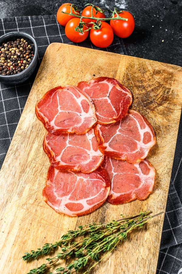 Raw Smoked Meat Jamon Lomo. Black Background Stock Image - Image of ...