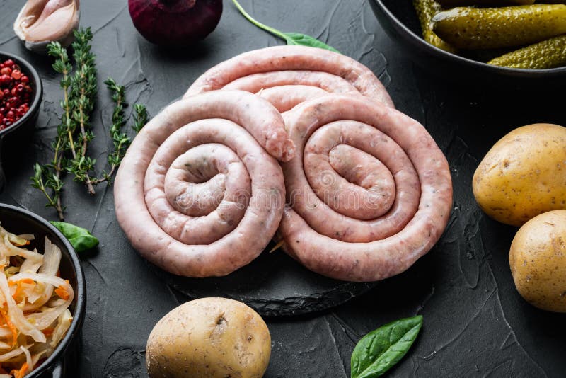 Raw Snail Sausage in Traditional Spiral, on Black Background Stock ...
