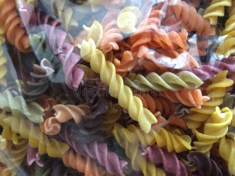 Raw Solid Colored Pasta in Transparent Packaging Ready To Cook Stock ...