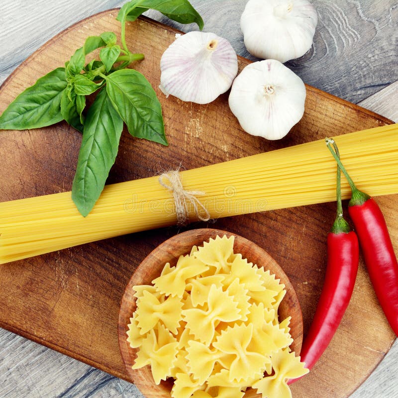 Raw Spagetti and Farfalle Pasta on the Table Stock Photo - Image of ...