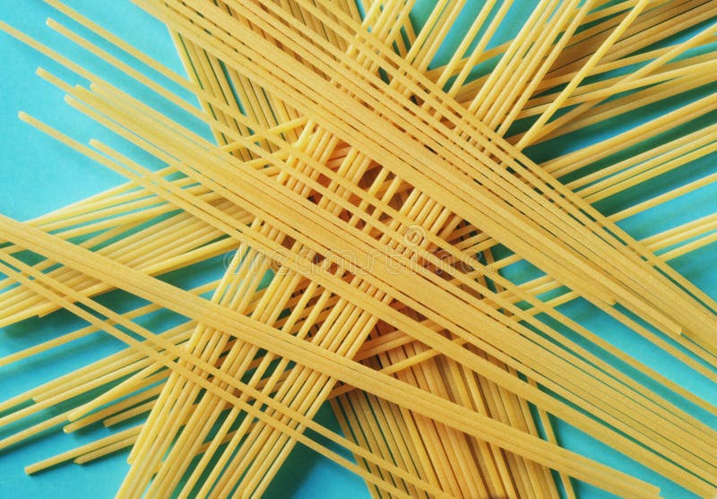 Raw Spaghetti on a Blue Background Stock Photo - Image of prepare ...