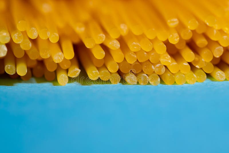 Raw Spaghetti on a Light Blue Background with Copy Space. Close Up ...