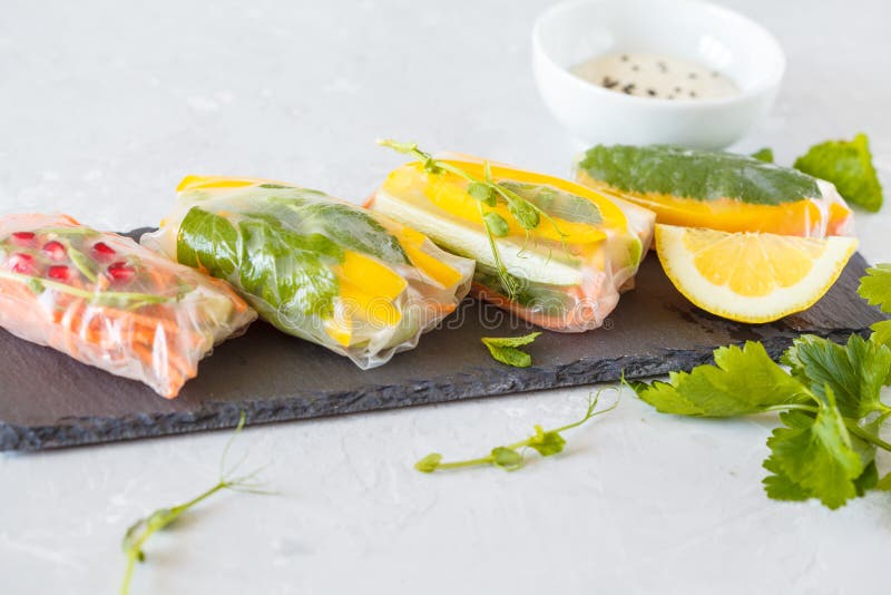Raw Spring Rolls with Vegetables on Slate Stock Photo - Image of roll ...
