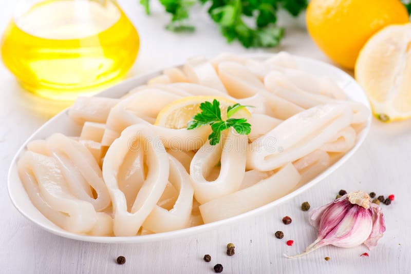 Raw Squid Rings on White Plate, Ready To Cook Stock Image - Image of ...