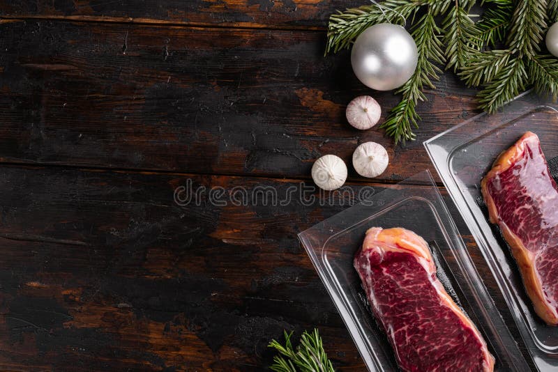 Raw Steak with Christmas Tree Decorations, on Old Dark Wooden Table ...