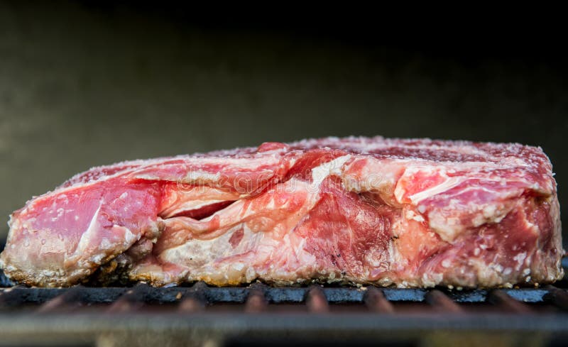 Raw Steak Cooks on Hot Grill Stock Photo - Image of steak, cookout ...