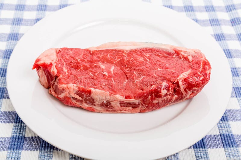 Raw Strip Steak on White Plate Stock Image - Image of beefsteak, plate ...