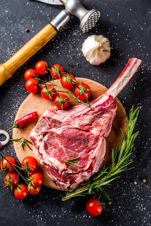Raw tomahawk steak stock photo. Image of cooking, wooden - 197753318