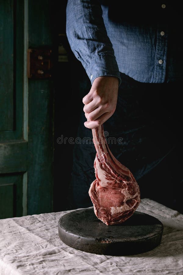 Raw tomahawk steak stock image. Image of barbecue, space - 165949315