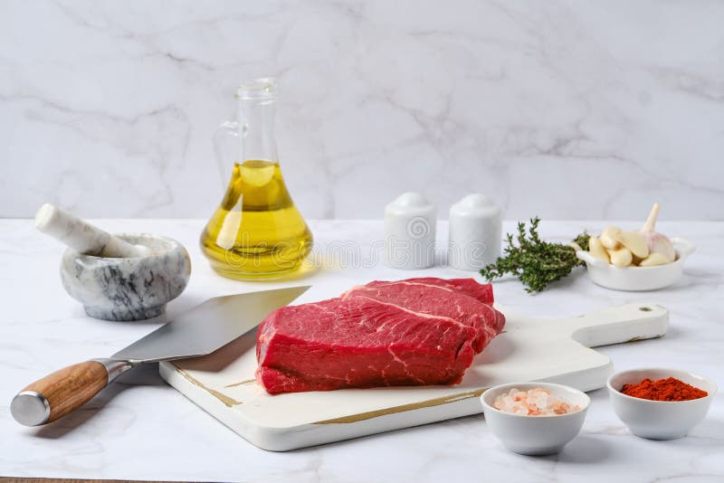 Raw Top Side Beef Steak on Kitchen Table Stock Photo - Image of slice ...