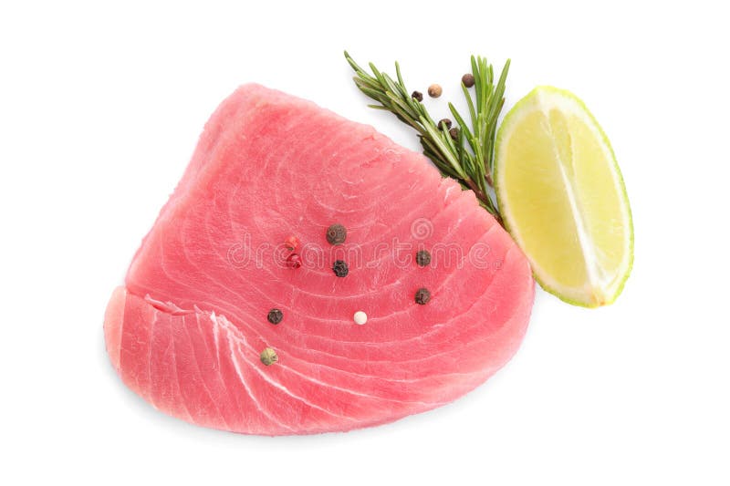 Raw Tuna Fillet with Spices and Lime Wedge on White, Top View Stock ...
