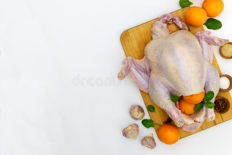 Raw Turkey is Being Prepared for Thanksgiving Dinner with Spices and ...